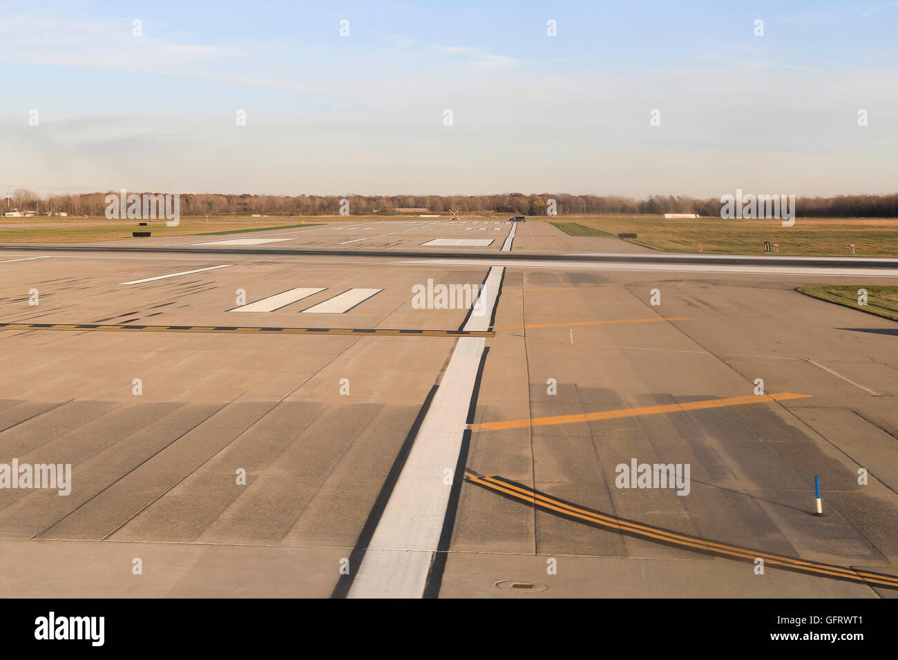 Runway marked with a black wheel marks on the runway Stock Photo - Alamy