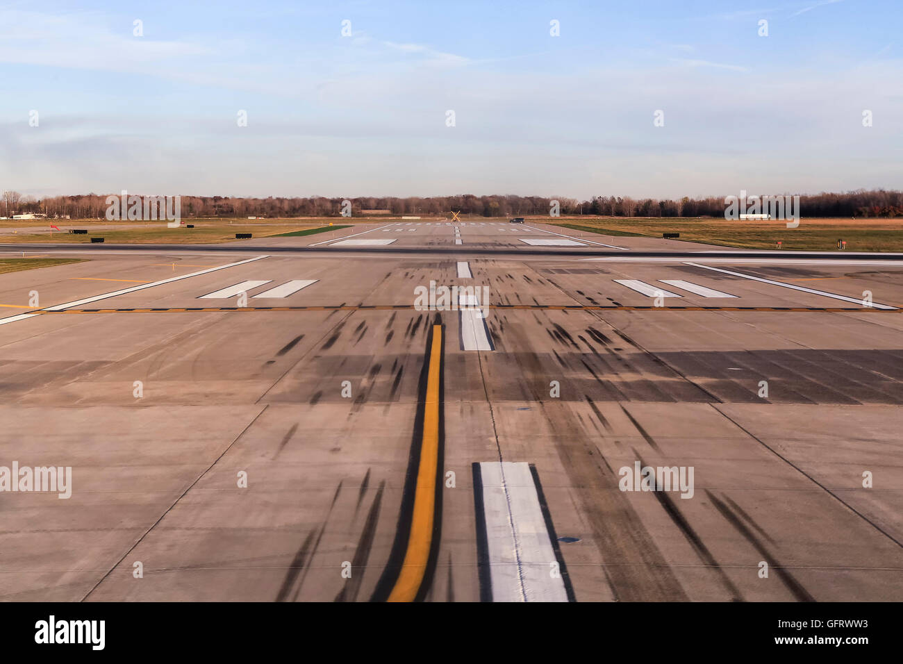 Runway marked with a black wheel marks on the runway Stock Photo - Alamy