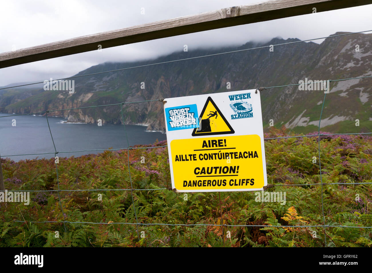 Warning sign Caution Dangerous Cliffs by Slieve league sea cliffs in ...