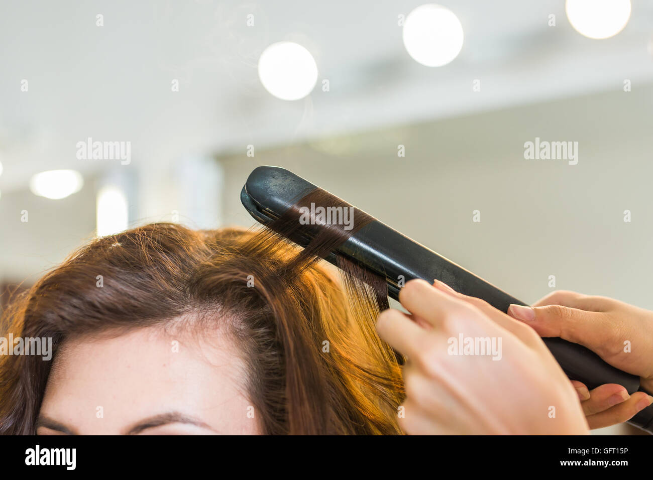 Curling hair in beauty salon Stock Photo - Alamy