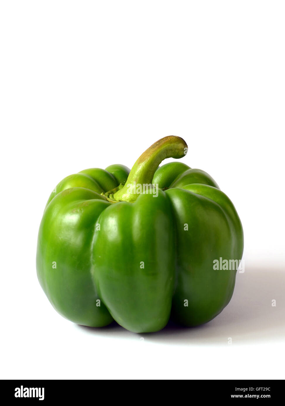 Green bell pepper on a white background Stock Photo - Alamy