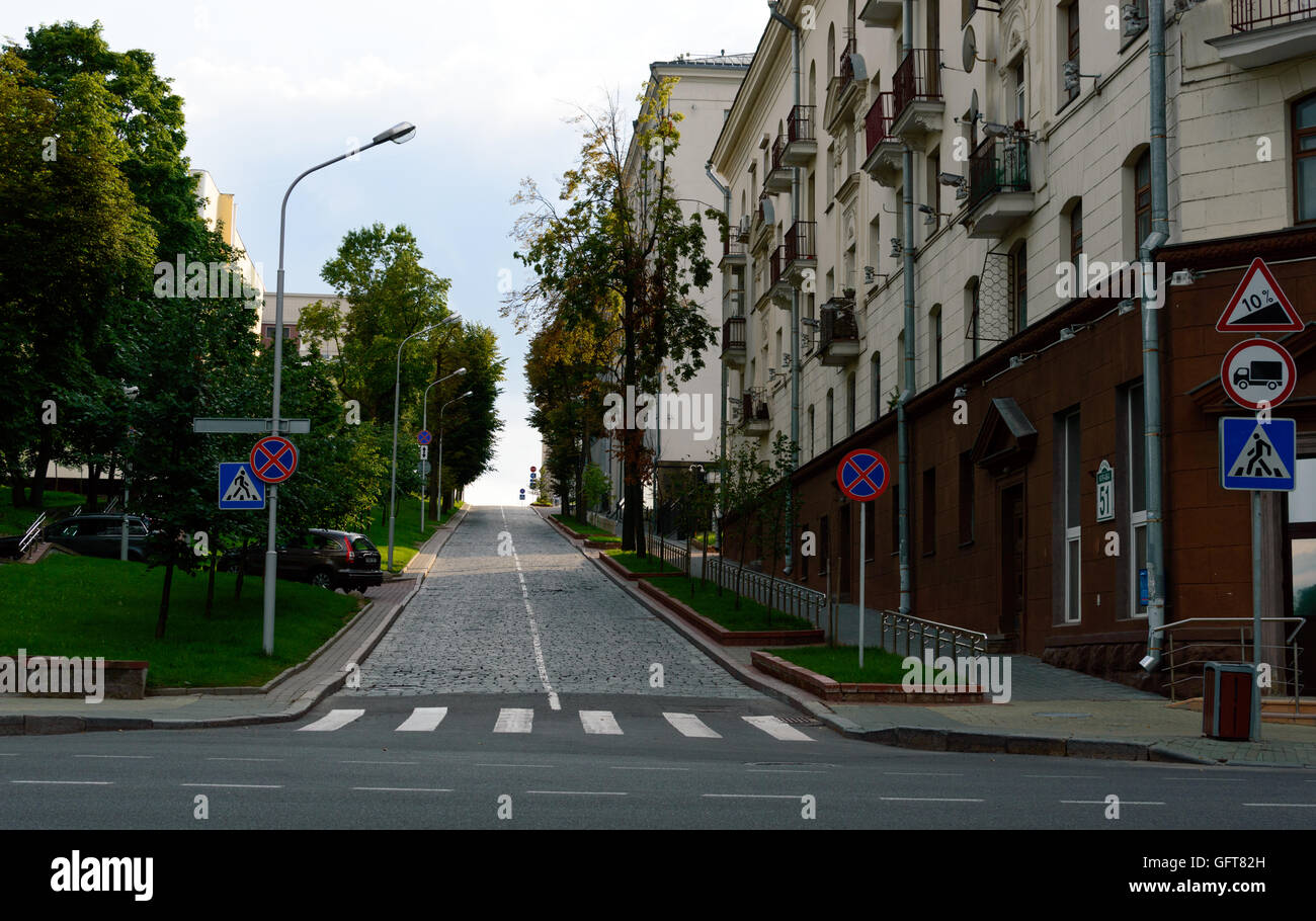 City street with cross walk. Traffic signs and buildings Stock Photo ...