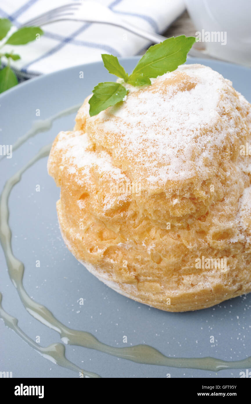 Choux pastry filled with whipped cream hi-res stock photography and ...