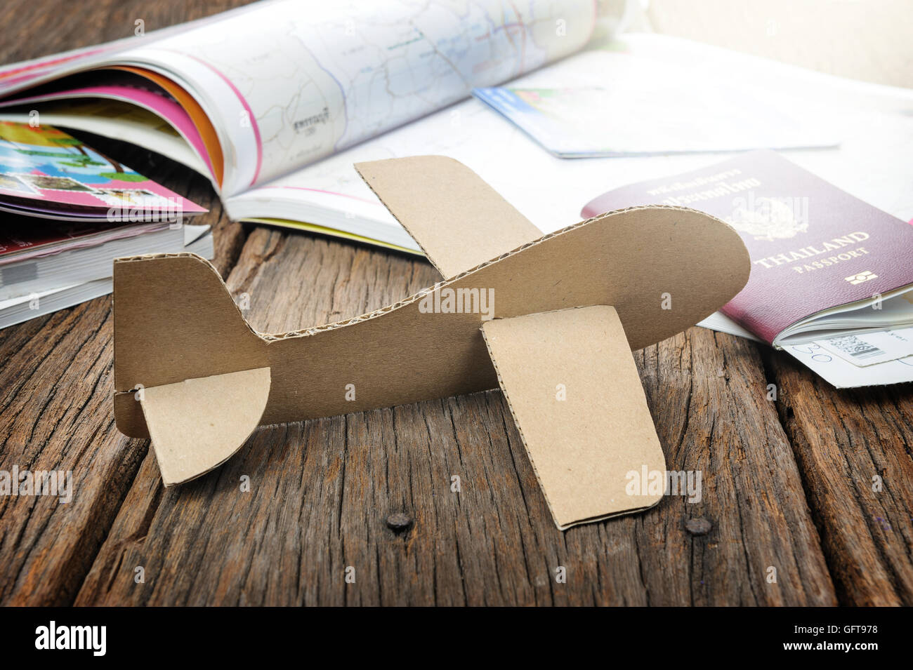 cardboard plane on wooden table Stock Photo - Alamy