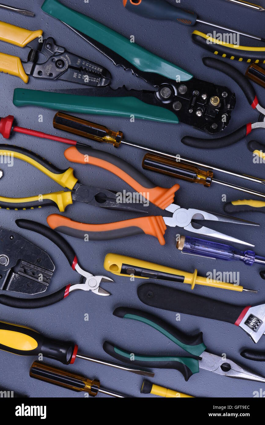 Set of tools to electrical installations on metal background Stock ...