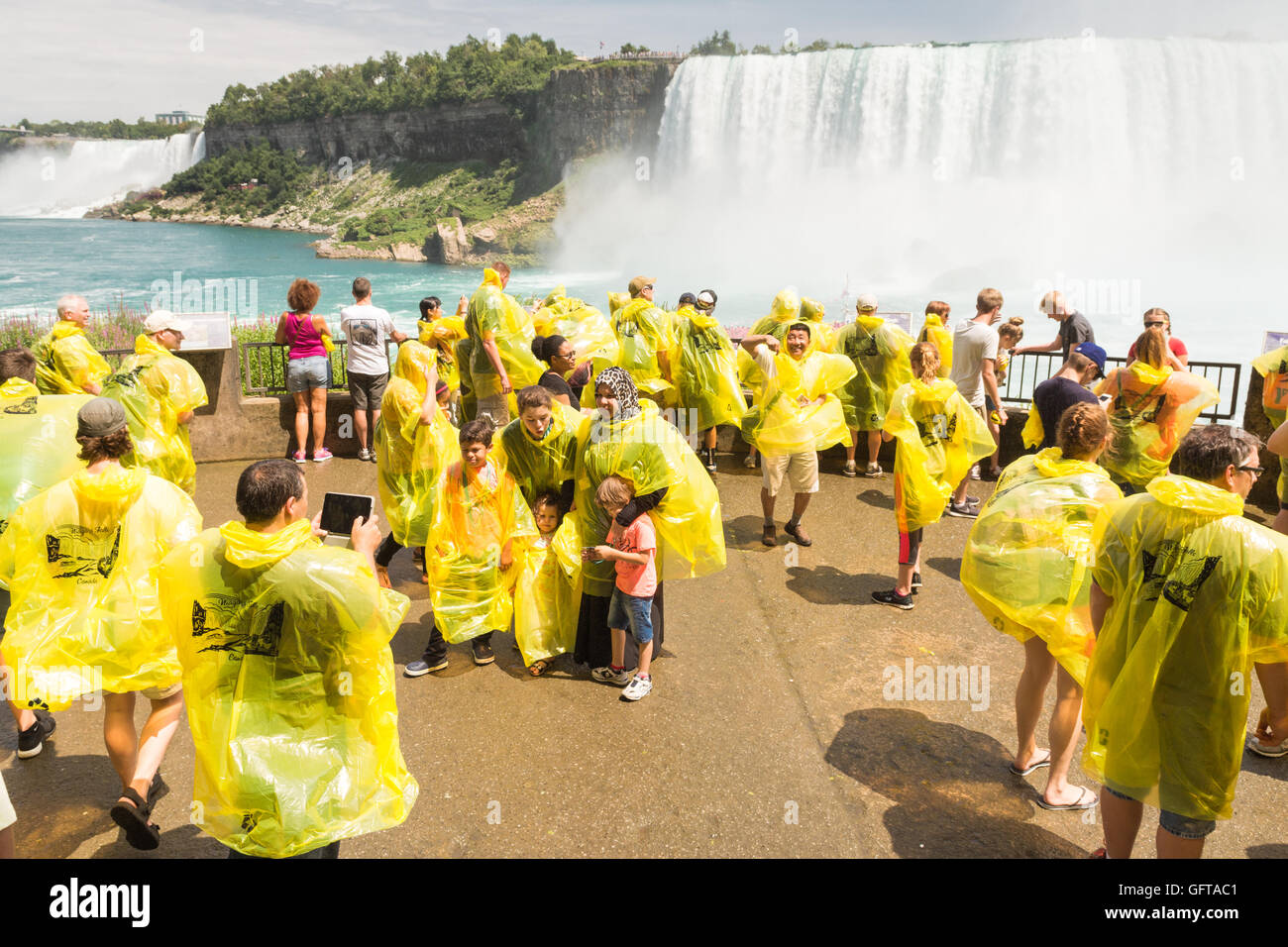 Yellow rain coats hi-res stock photography and images - Alamy