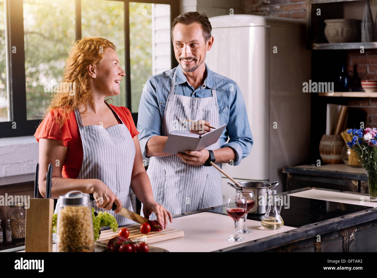 Woman and man in the kitchen Stock Photo - Alamy