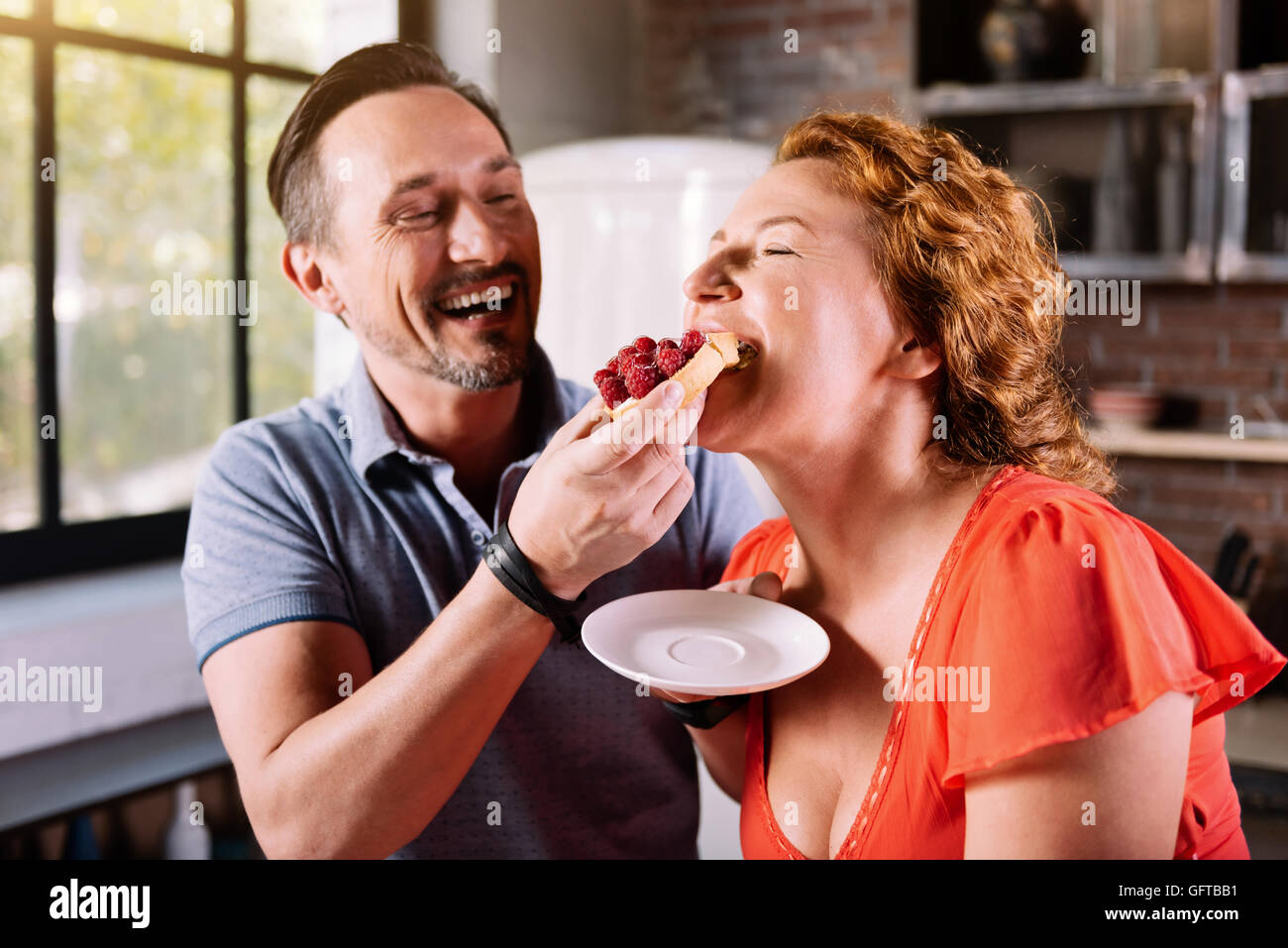 Middle aged couple laugh table hi-res stock photography and images - Alamy