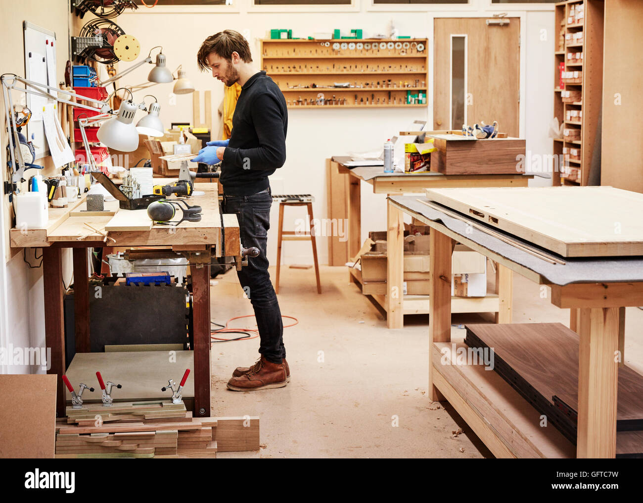 Furniture workshop man standing workbench hi-res stock photography and ...