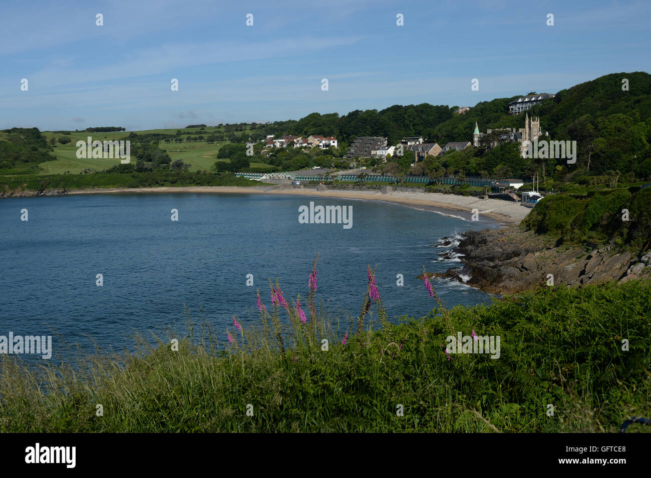 coast path views of sheltered bay and headlands at Langland , Gower ...