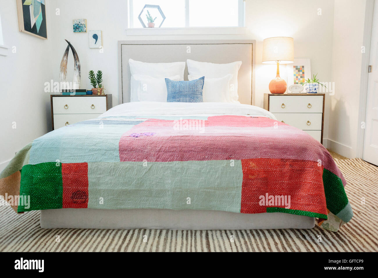 A bedroom in an apartment with a double bed and a retro look antique ...