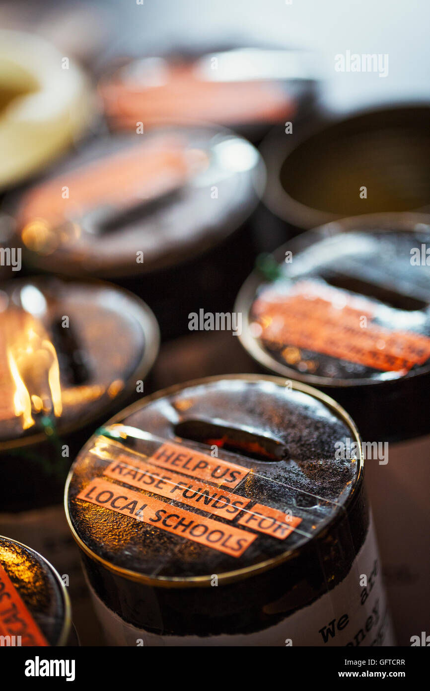 Charity collecting tins with a message about fundraising Stock Photo ...