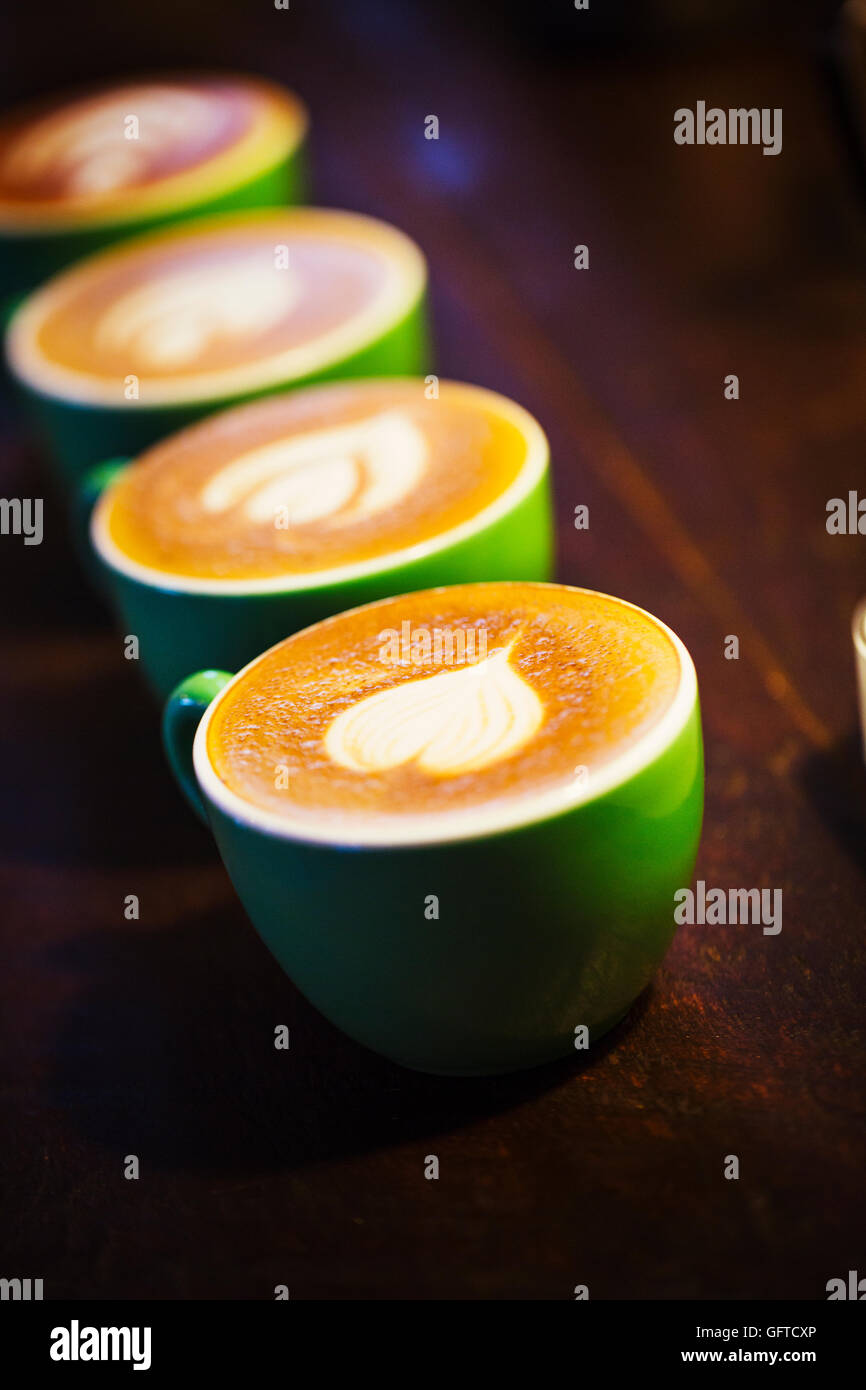 Cups of coffee with patterns in the froth on the top Stock Photo - Alamy
