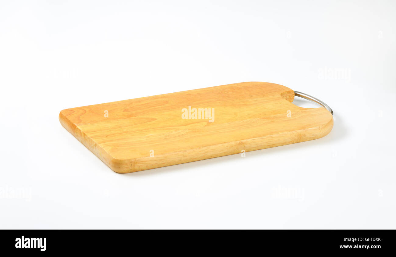 Wooden cutting board with metal handle Stock Photo - Alamy