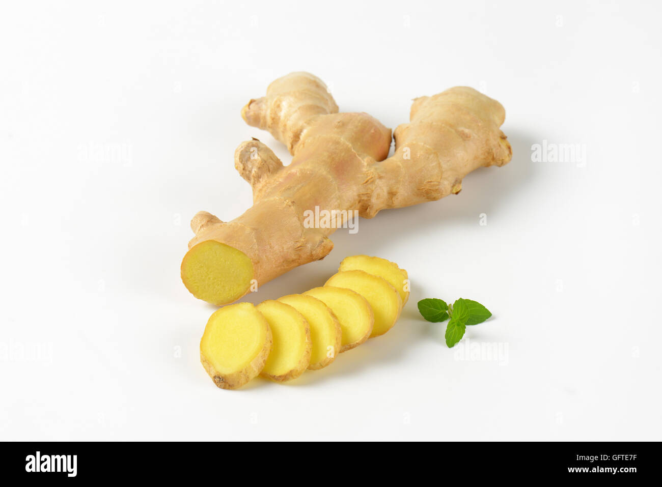 fresh ginger root on off-white background with shadows Stock Photo - Alamy