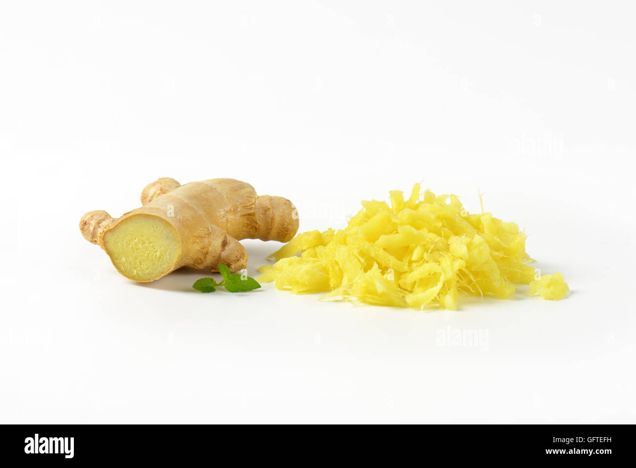 whole and grated fresh ginger on white background Stock Photo - Alamy