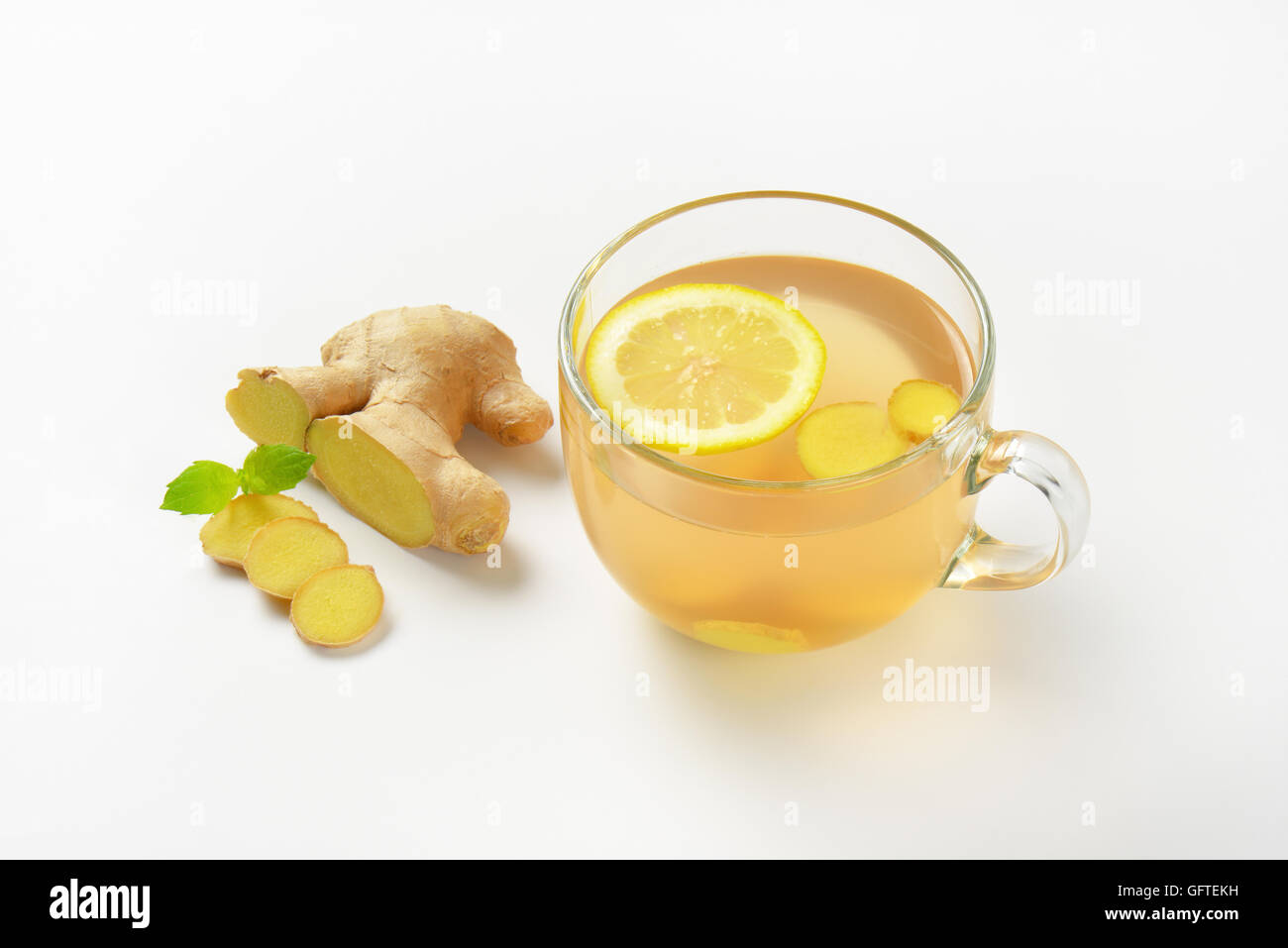 cup of ginger tea with lemon and fresh ginger on white background Stock ...