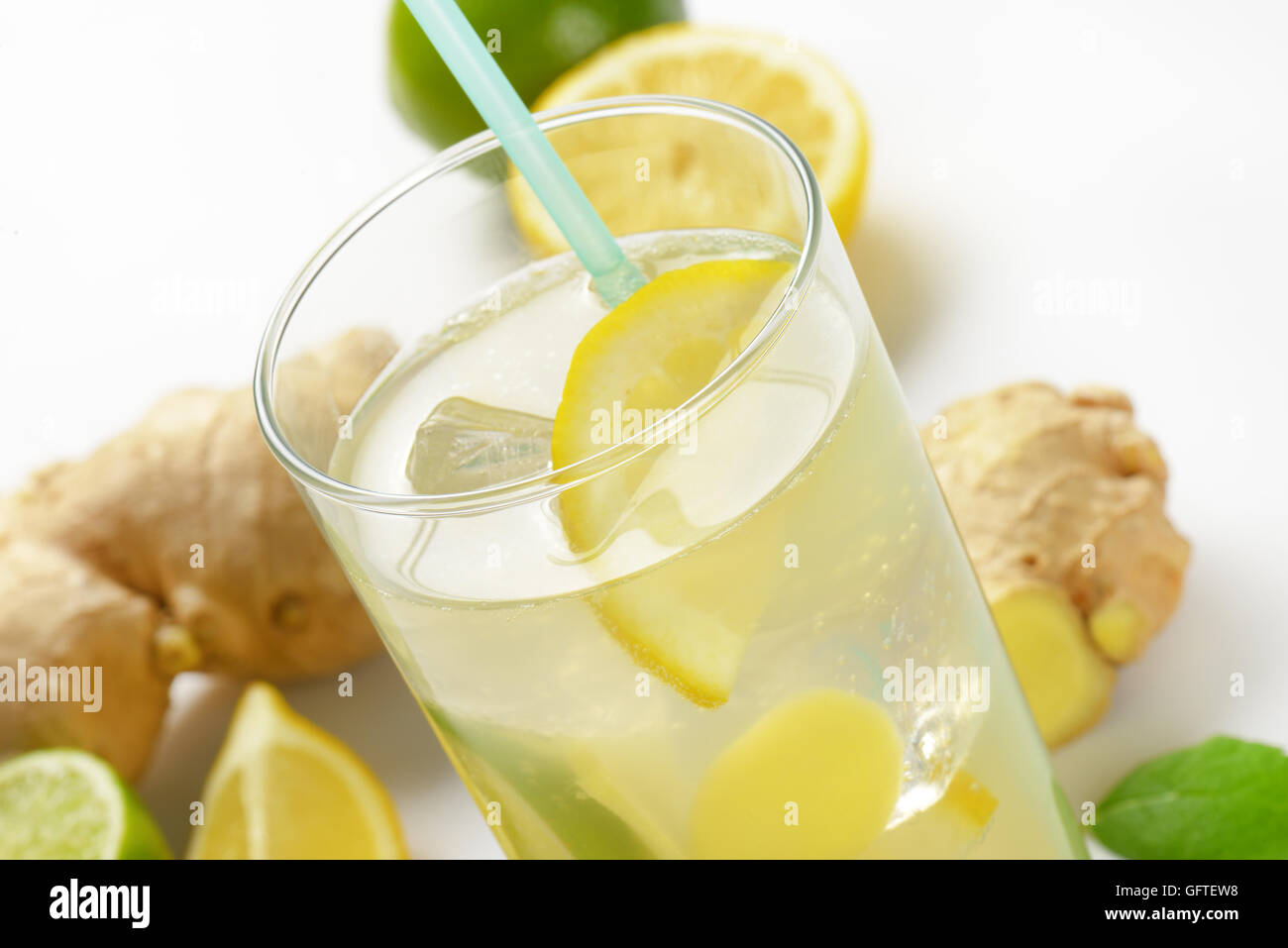 detail of glass of ginger ice tea with lemon and fresh ginger Stock ...