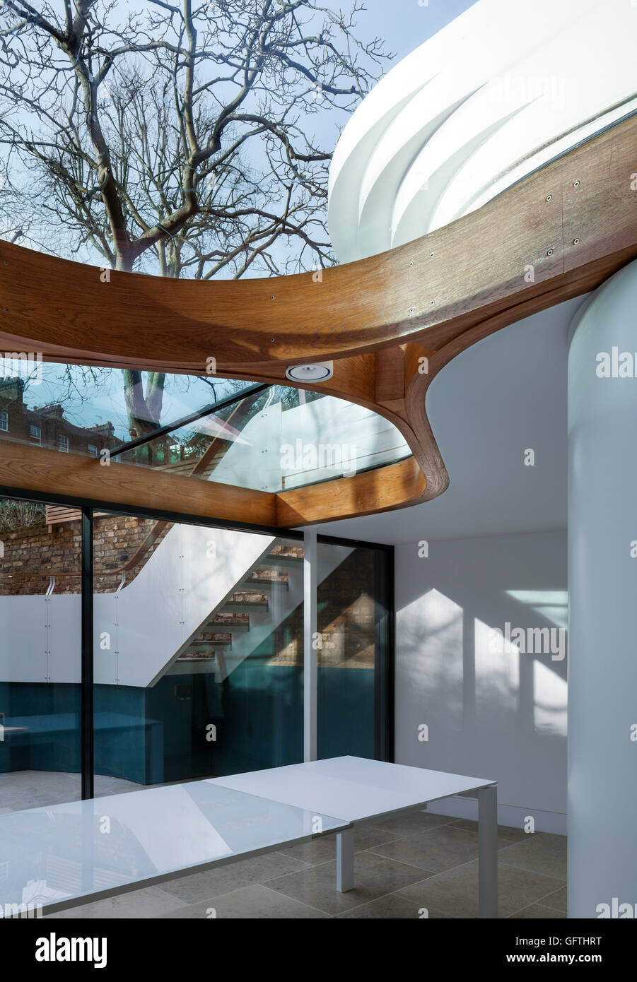 The low cold light of winter enters the interior space, shadows and ...