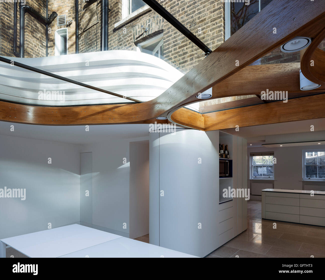 The low cold light of winter enters the interior space, shadows and ...