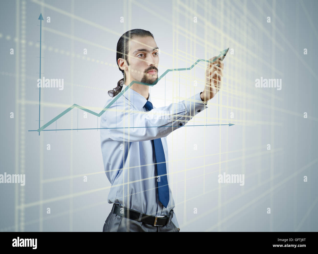 Young businessman with chart diagrams Stock Photo - Alamy