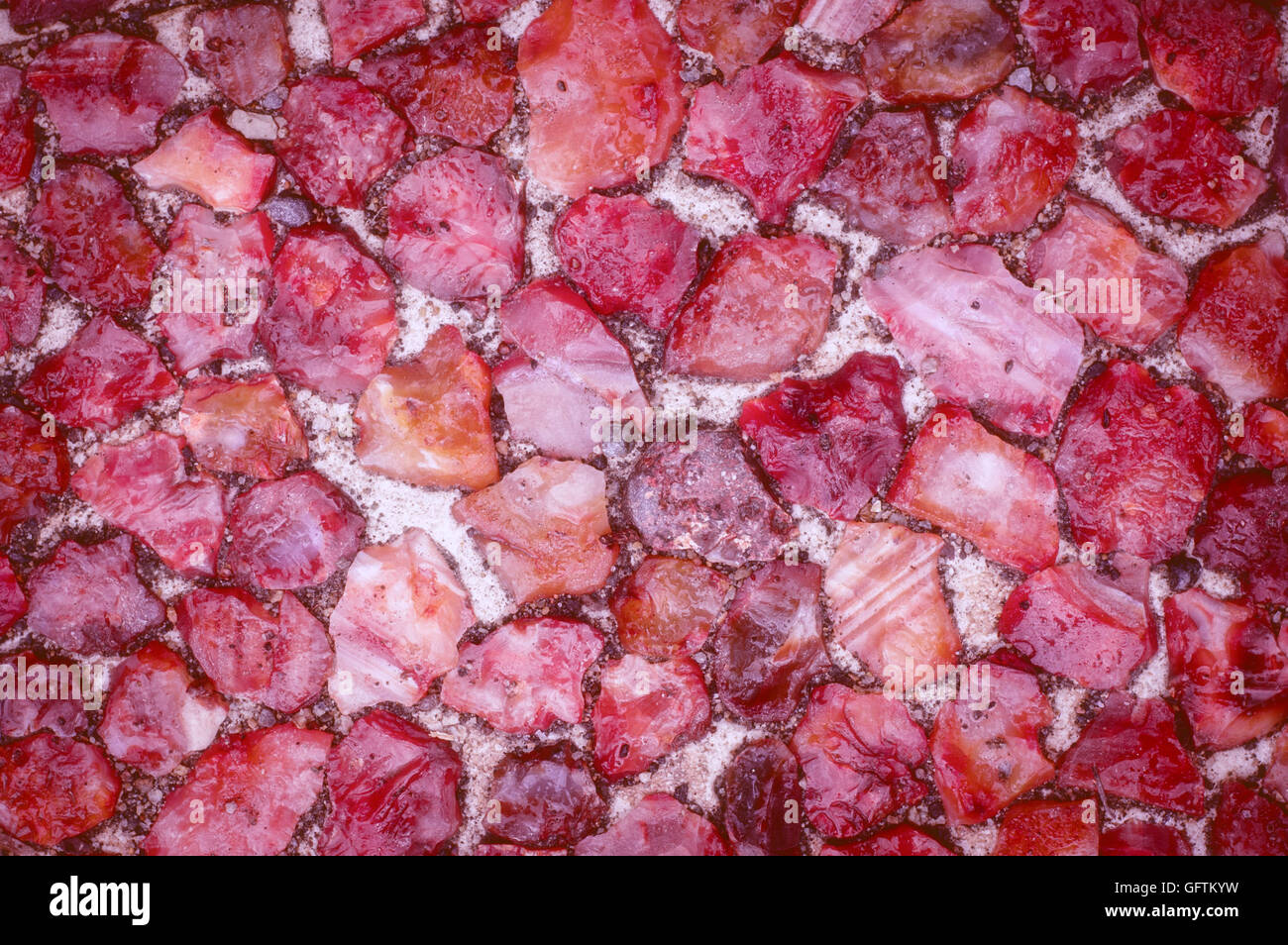 Bright red stones as a background Stock Photo - Alamy
