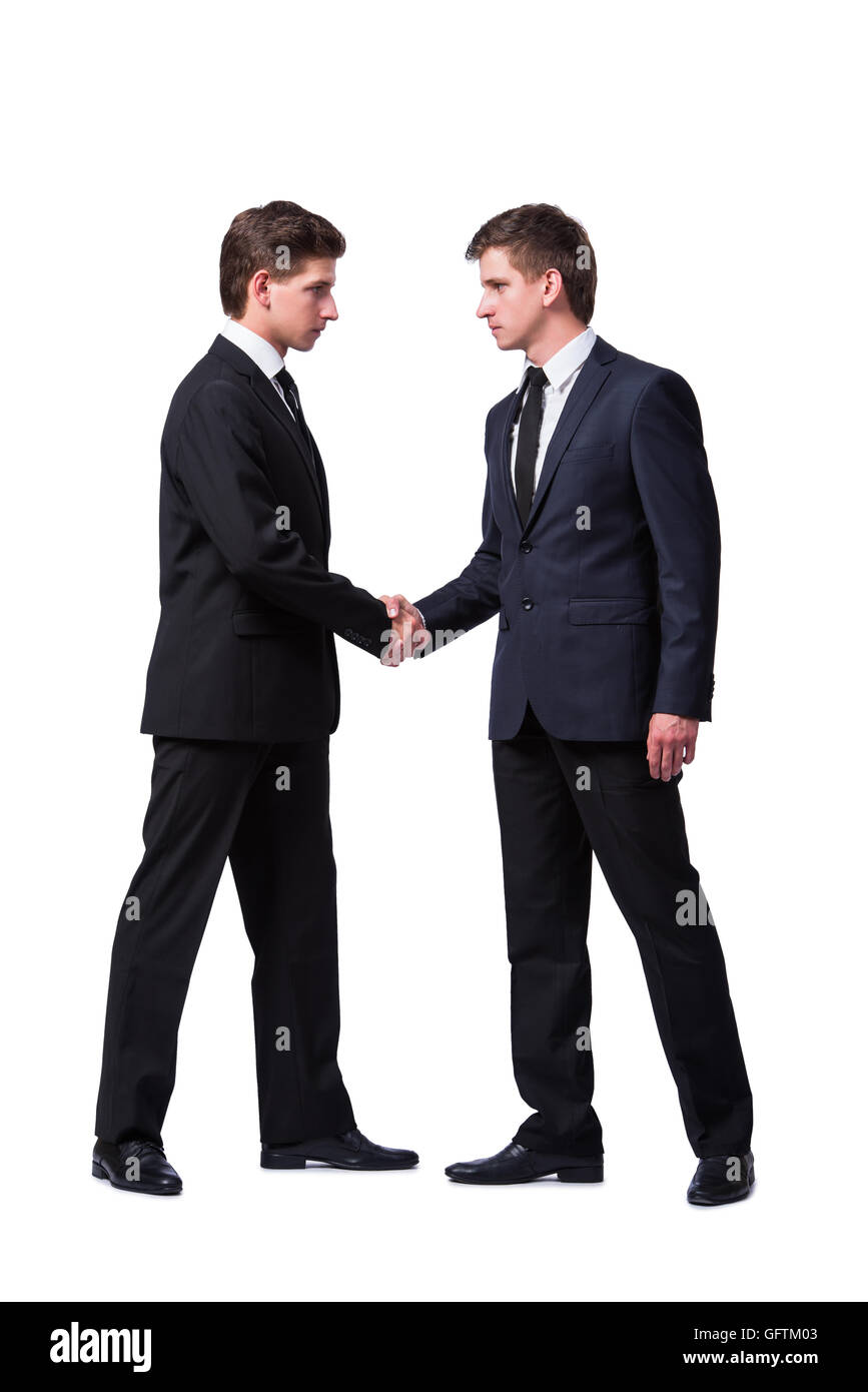 Two twin brothers handshaking isolated on white Stock Photo - Alamy