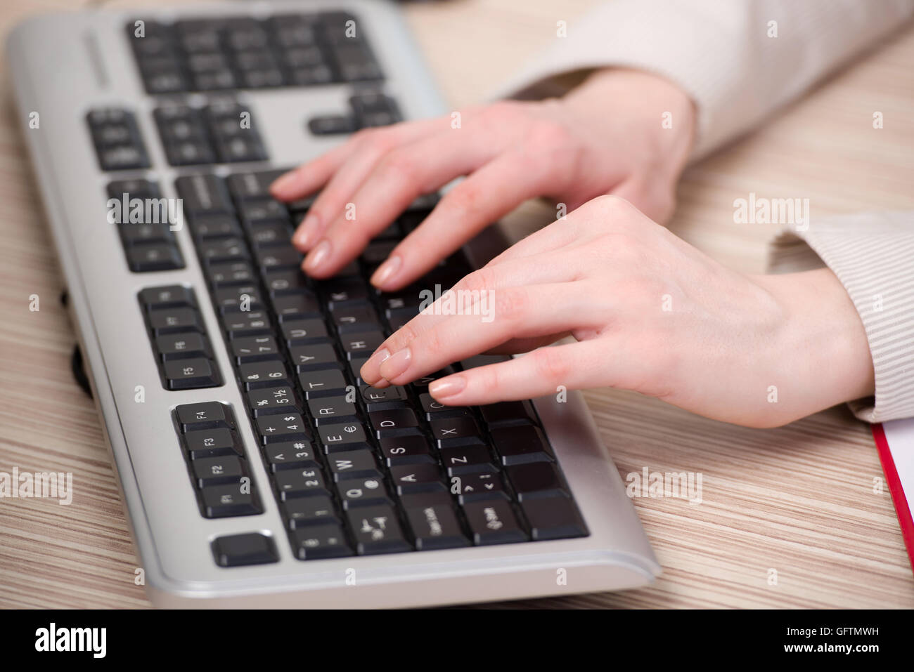 Hands working on the keyboard in the office Stock Photo - Alamy