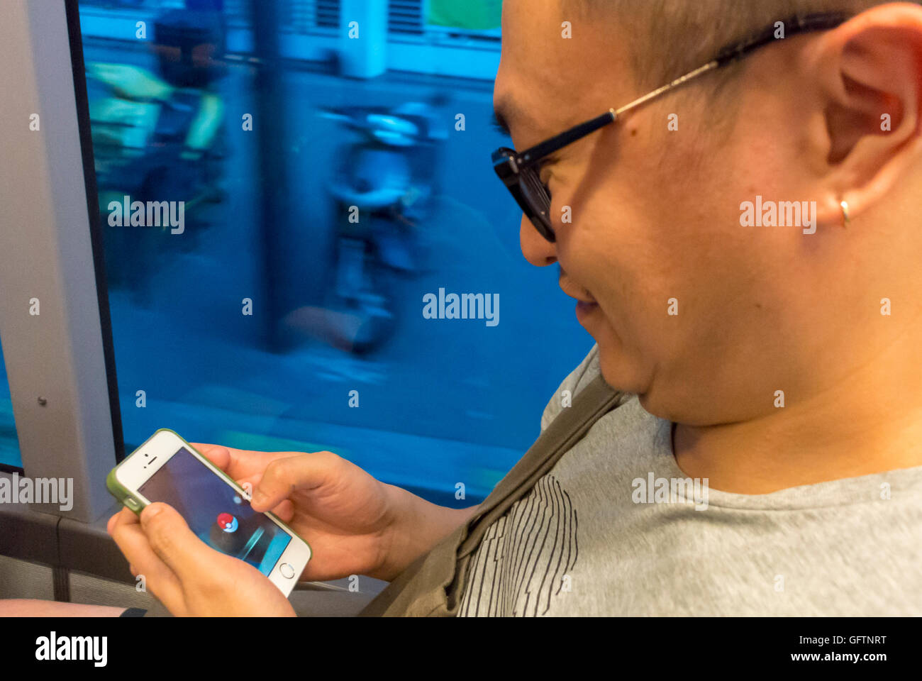 Paris, France, Chinese Man, Looking at Screen, Smart Phone, Playing ...