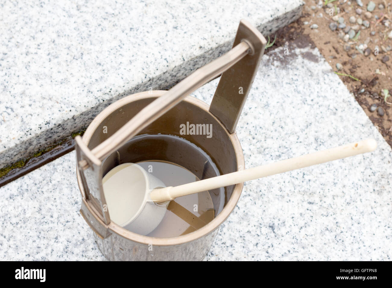 Japanese religious bucket and ladle to baptize in the grave Stock Photo ...