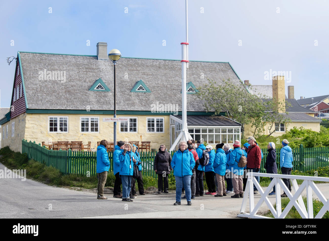 Tourist group with tourists outside Hans Egede House built 1728 it is ...