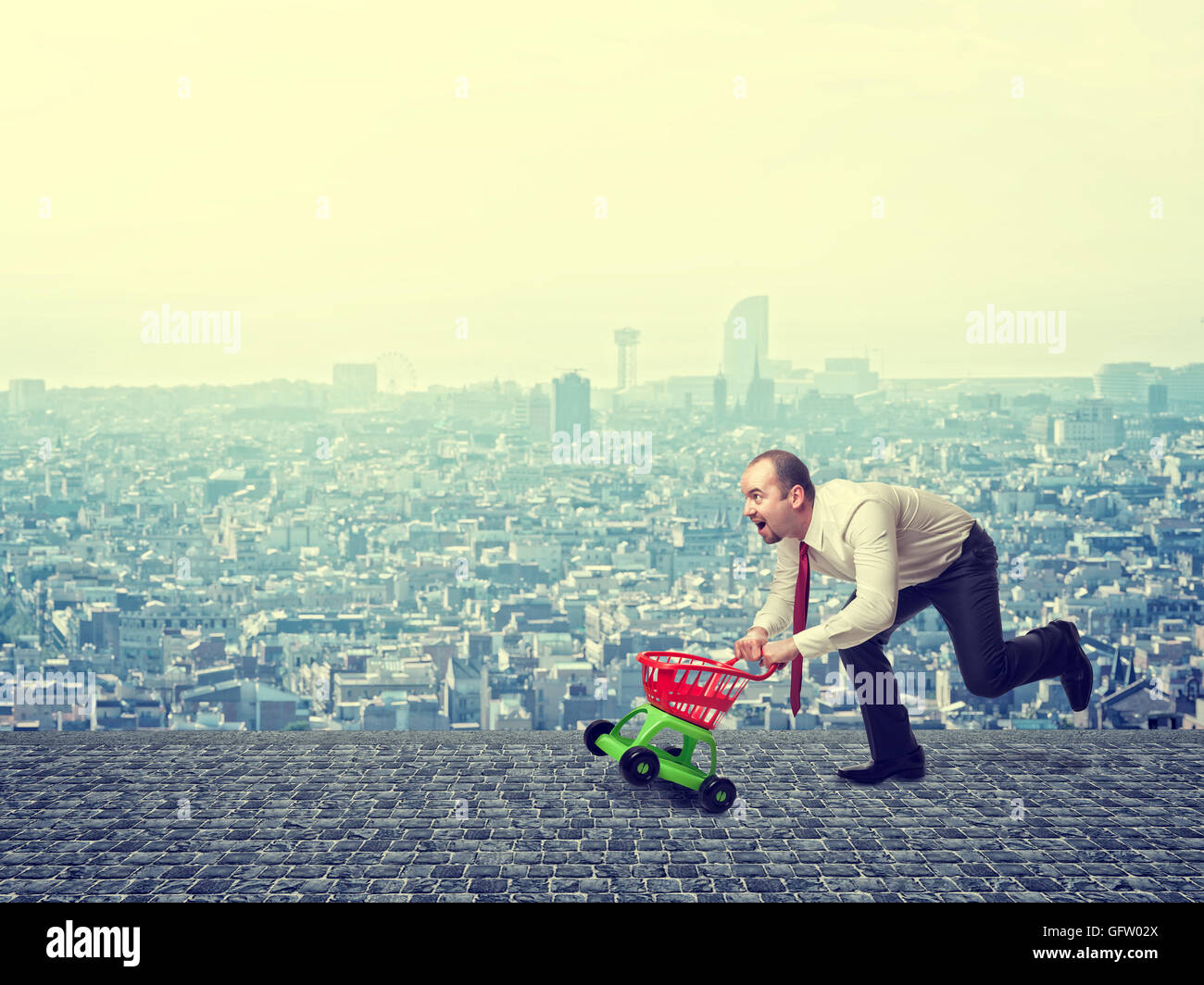 man with toy trolley and urban background Stock Photo - Alamy