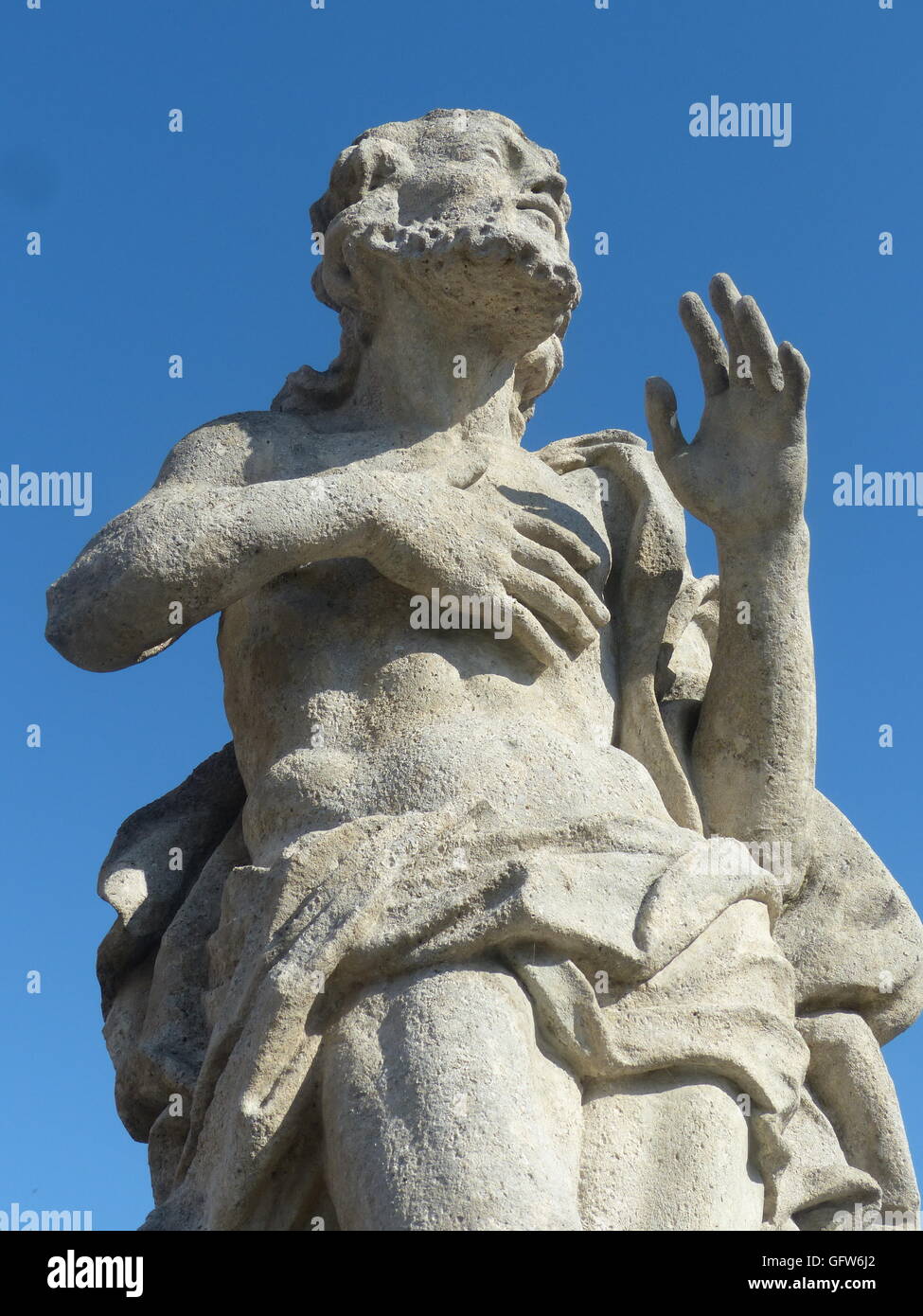 Stone statue of saint Stock Photo - Alamy