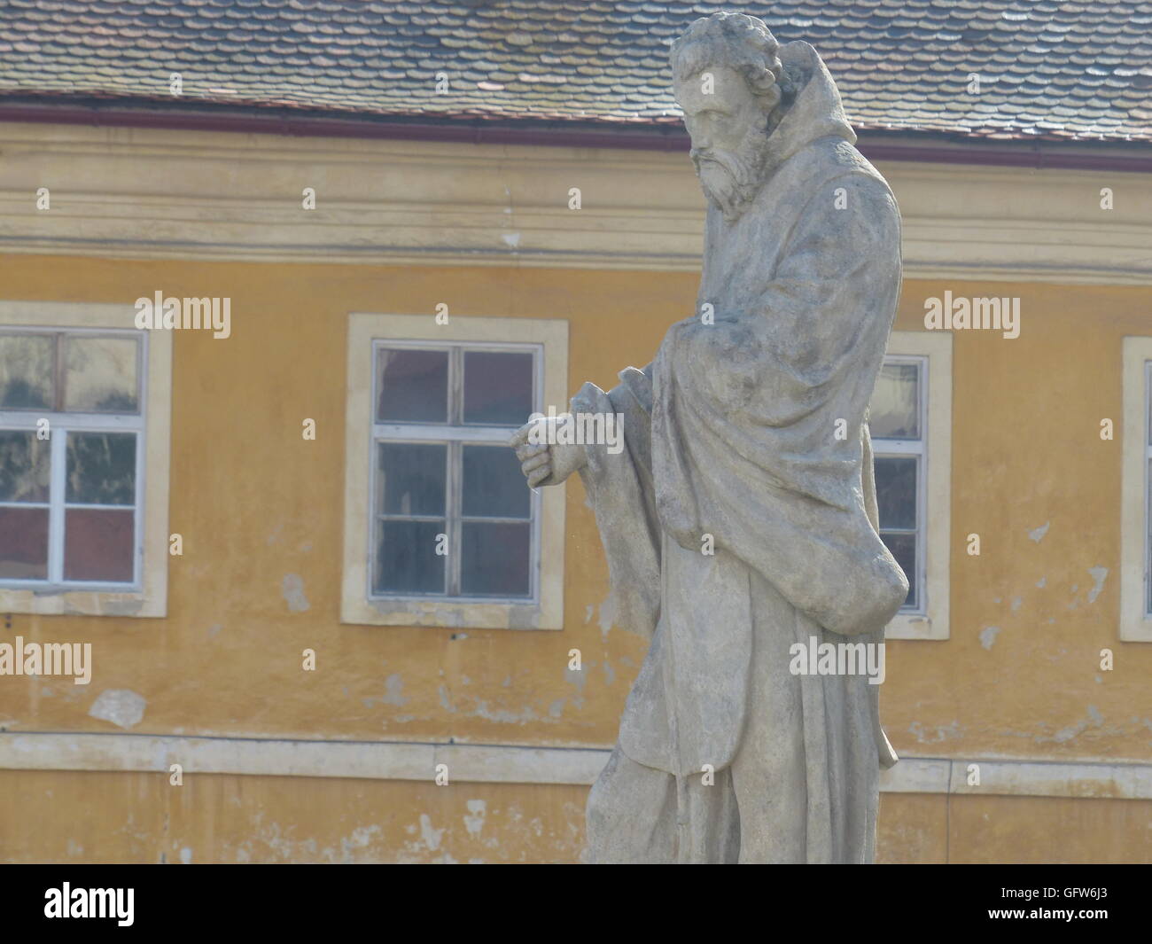 Stone statue of saint Stock Photo - Alamy