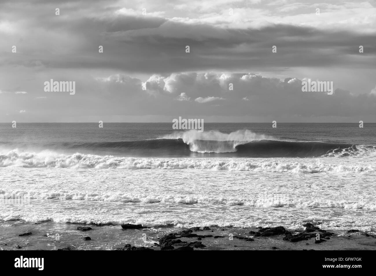Ocean large waves crashing along beach rocky coastline from weather ...