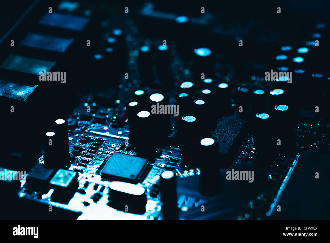 computer motherboard in blue dark background close-up Stock Photo - Alamy