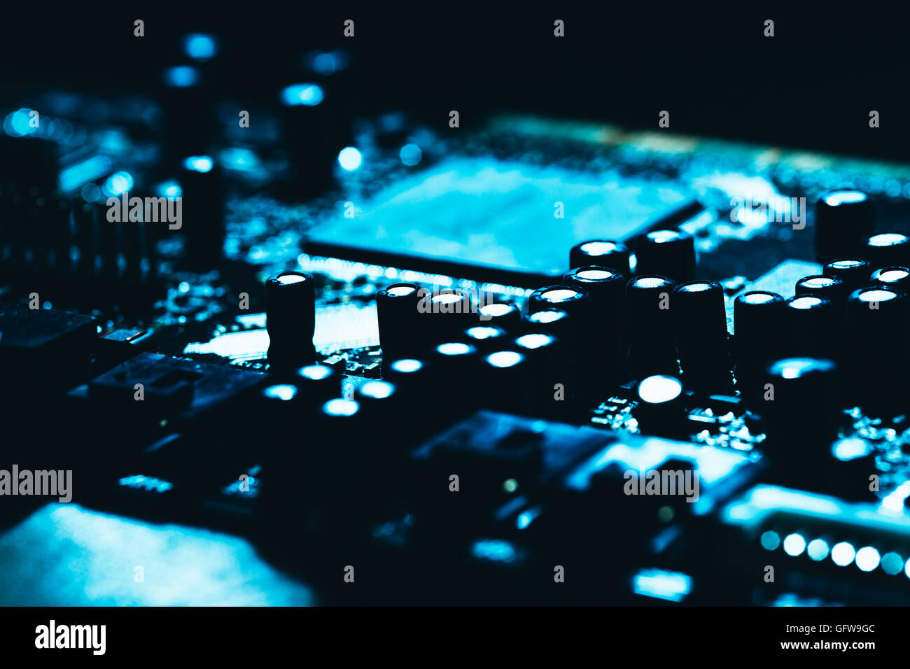 computer motherboard in blue dark background close-up Stock Photo - Alamy