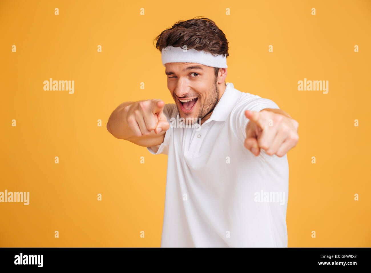 Winking friendly young man hi-res stock photography and images - Alamy