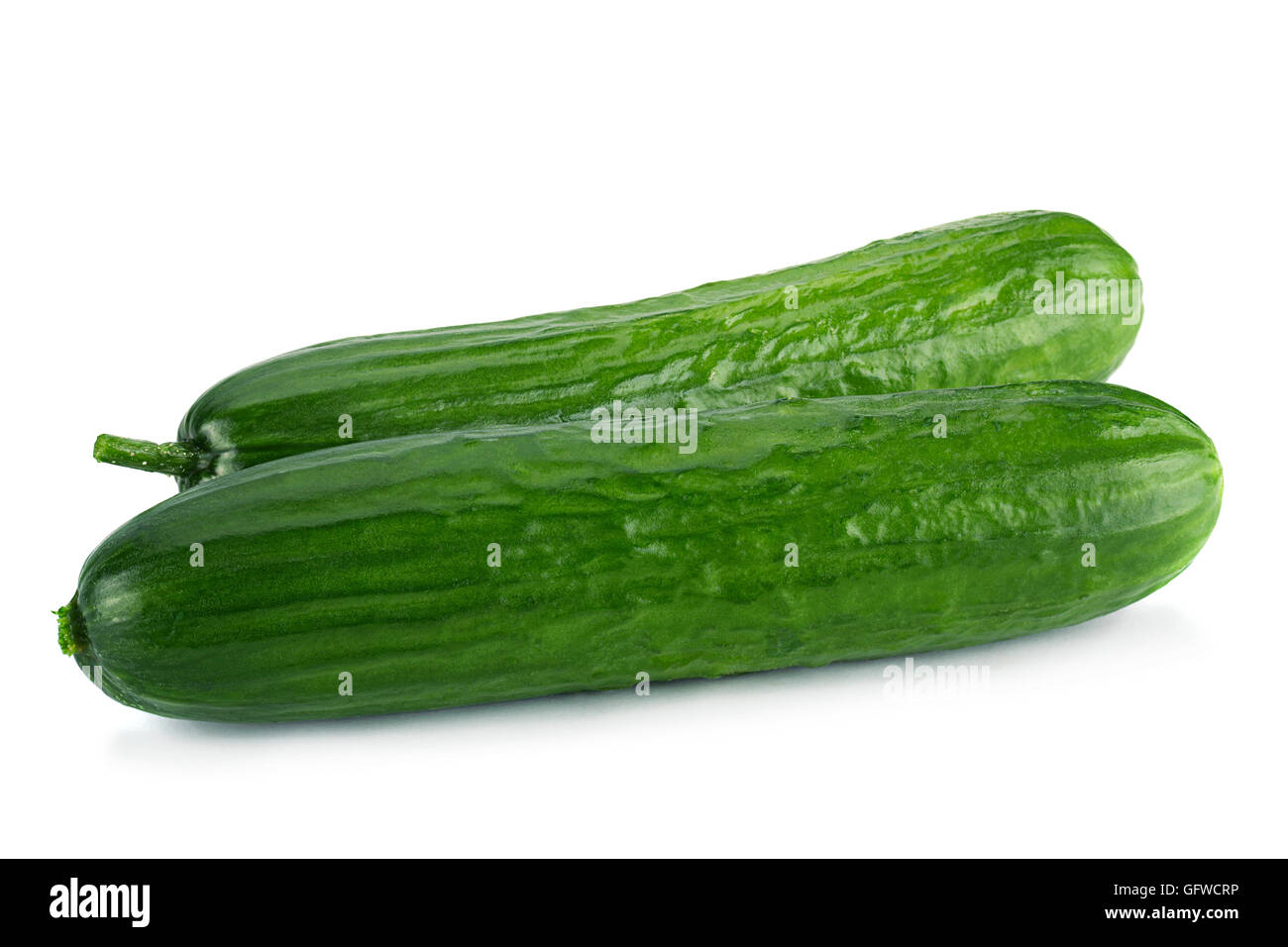 Long cucumber vegetable closeup isolated on white Stock Photo - Alamy