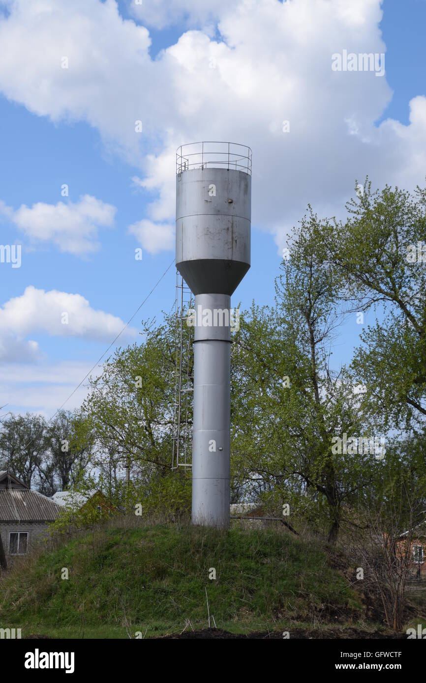 Rusty water tower. An old rustic communal communication Stock Photo - Alamy
