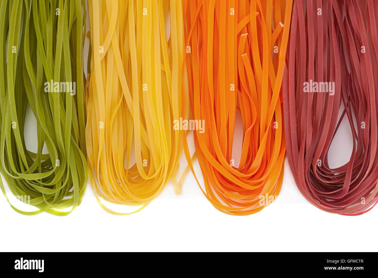 Wheat multicolored noodles isolated on white background Stock Photo - Alamy