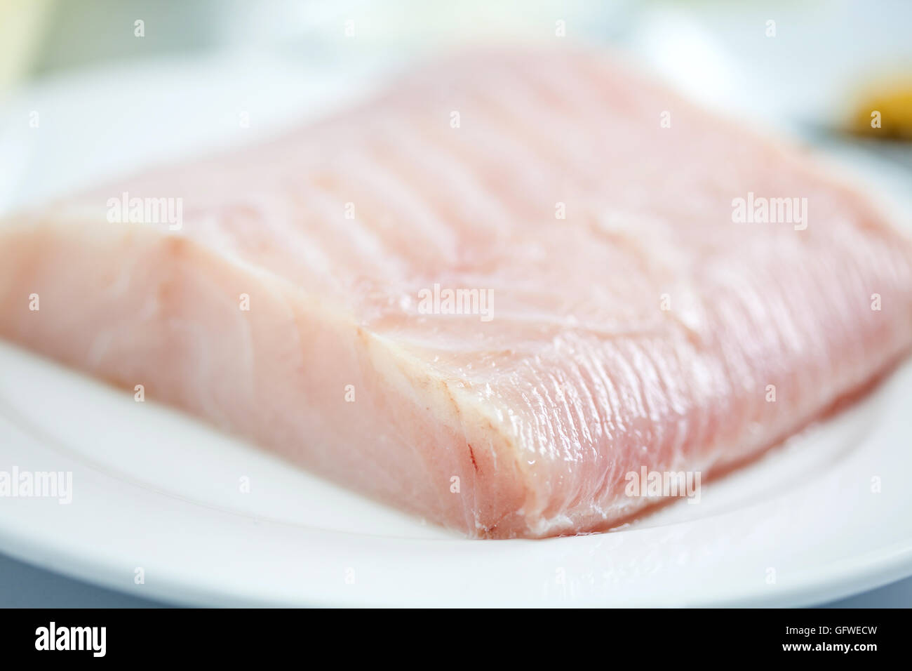Raw sea bass fillet Stock Photo - Alamy
