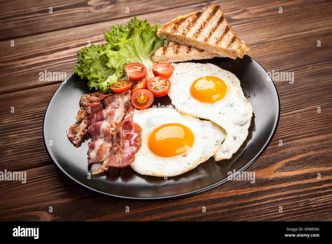 Traditional breakfast on a plate Stock Photo - Alamy