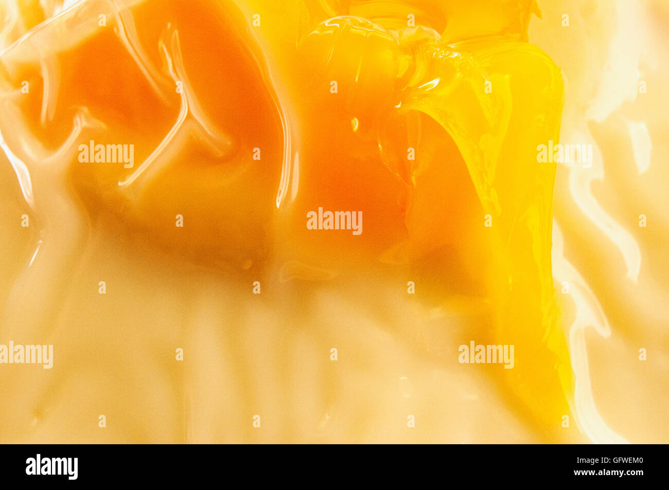 A close up of an egg yolk on a sunny side up egg Stock Photo - Alamy