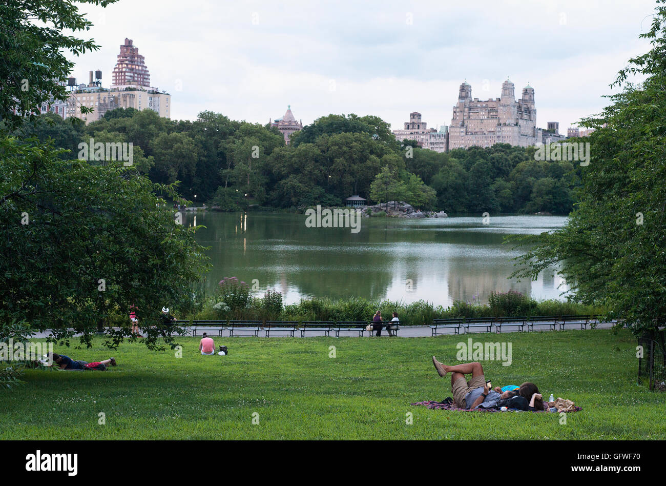 People laying around in Central Park Stock Photo - Alamy