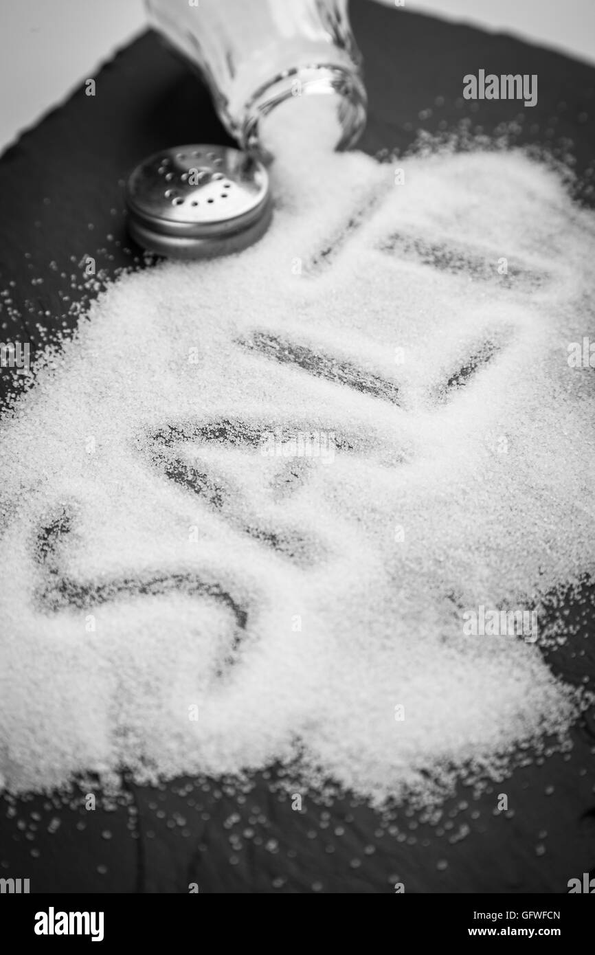 Salt shaker on slate board Stock Photo - Alamy