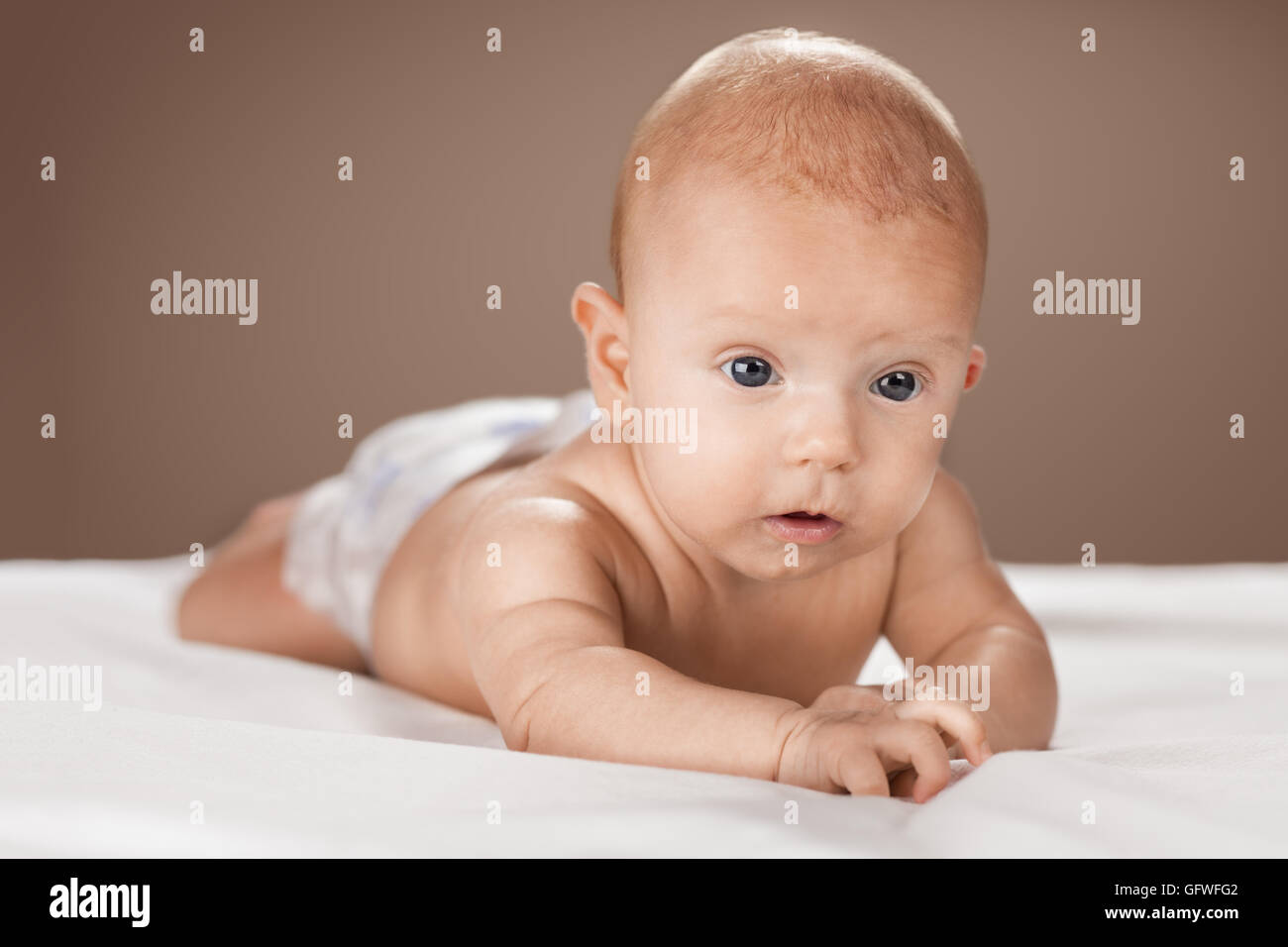 Baby girl crawling Stock Photo - Alamy