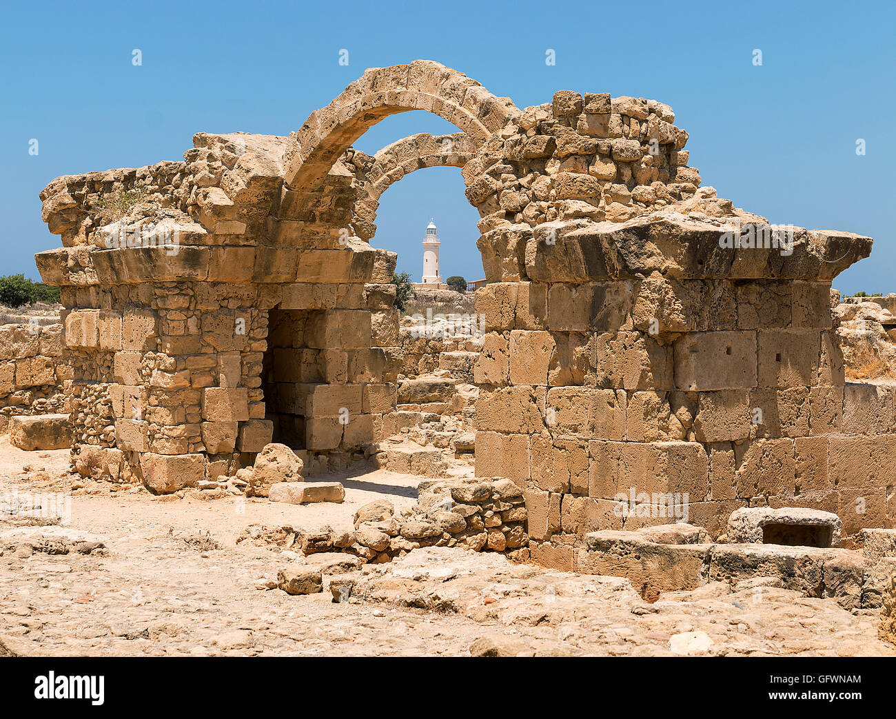 View of lighthouse through arch of Saranda Kolones fort, Cyprus, Paphos ...