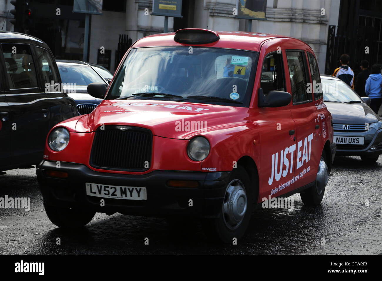 London England Red Taxi Advert Just Eat Stock Photo - Alamy