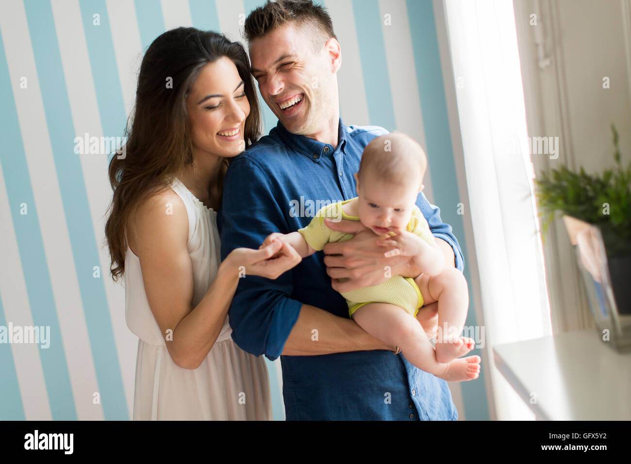 Happy family with newborn baby Stock Photo - Alamy